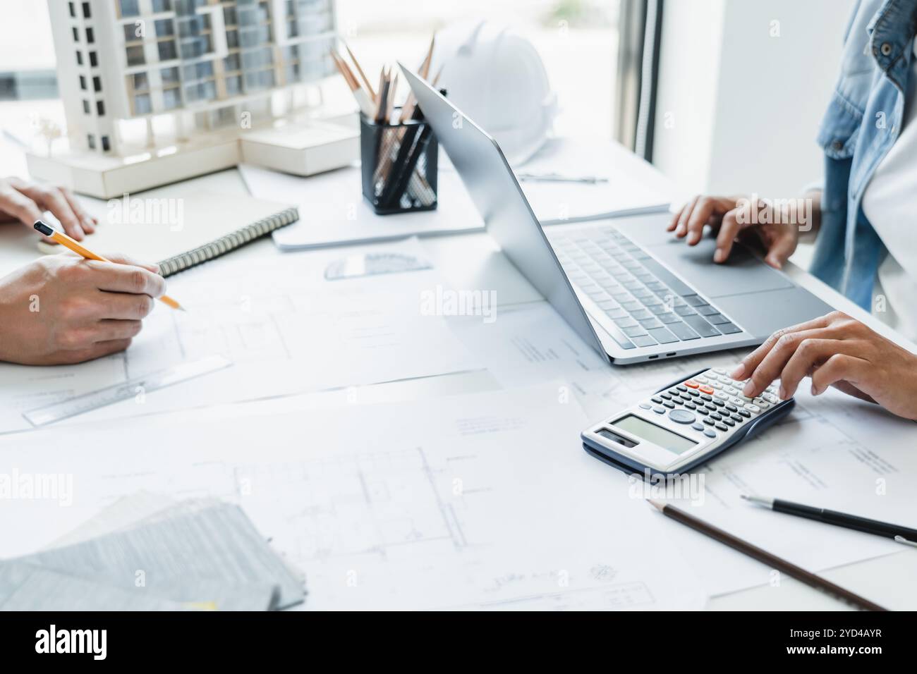 Architect workingÂ on the desk, construction project ideas architecture ...