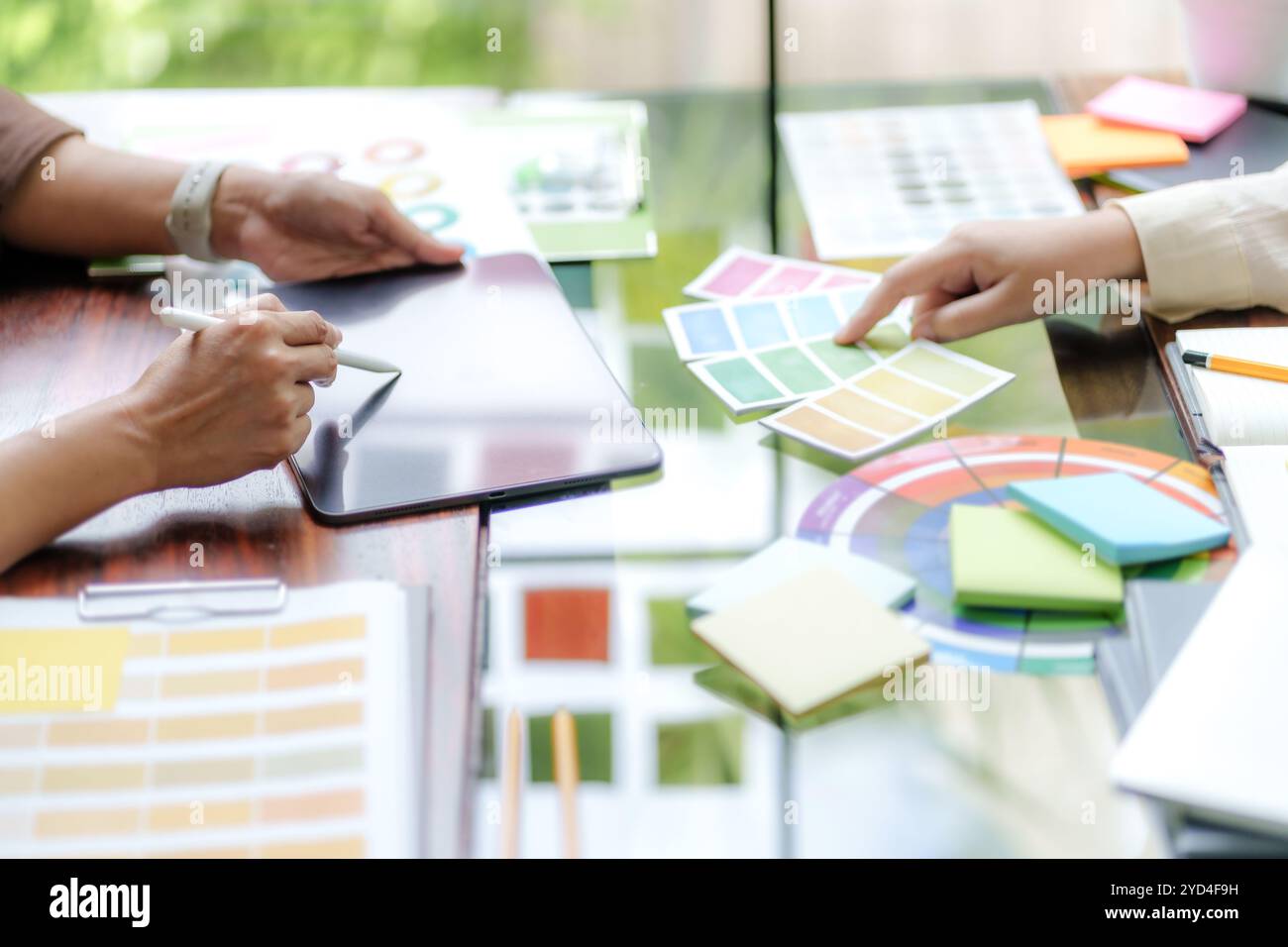 Architects designer team working with color palette chart Stock Photo - Alamy
