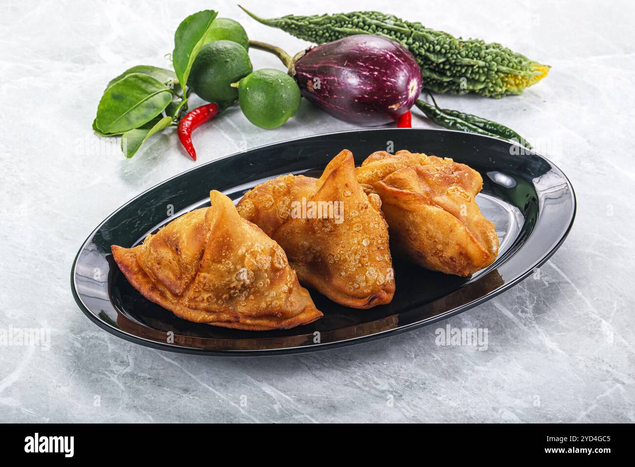 Indian cuisine - fries crispy stuffed samosa Stock Photo - Alamy