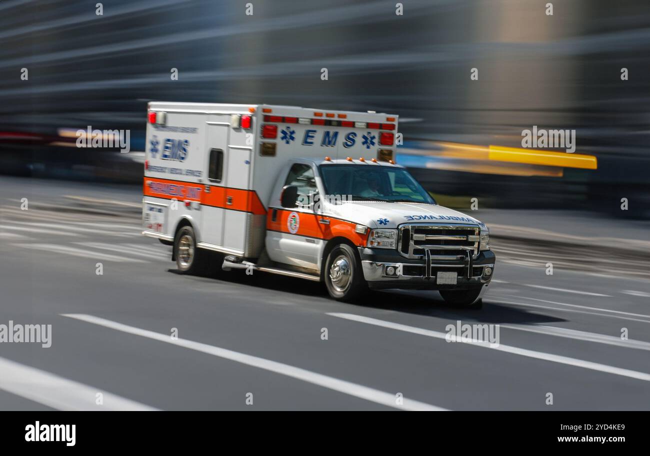 Rushing Urban Ambulance Stock Photo - Alamy