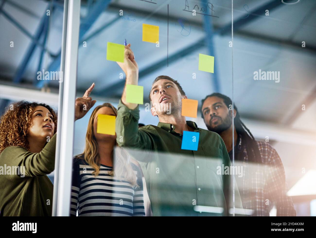 Thinking, business and people with notes on glass wall for planning ...