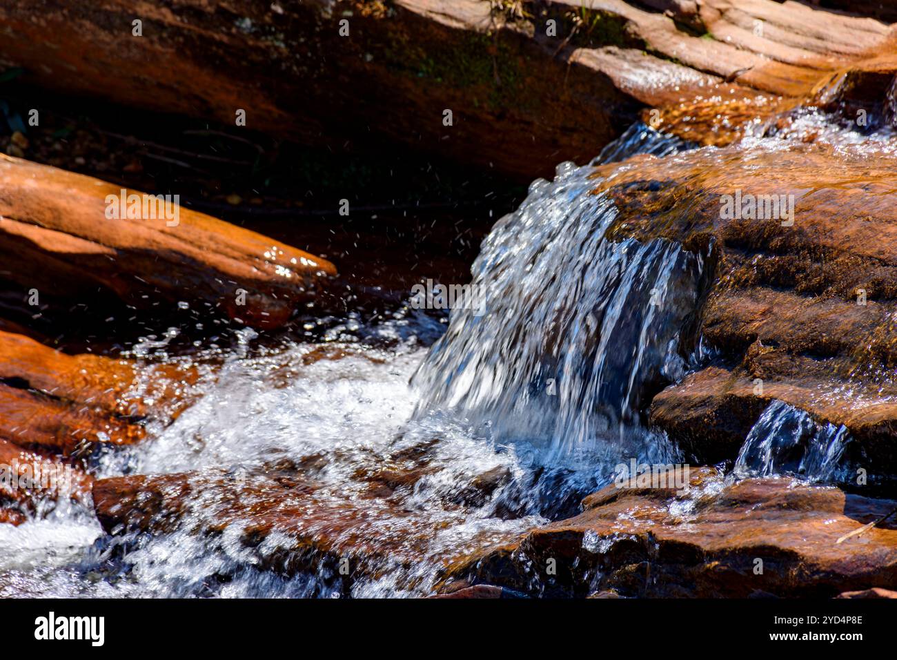 Creek water flowing down rocks hi-res stock photography and images - Alamy