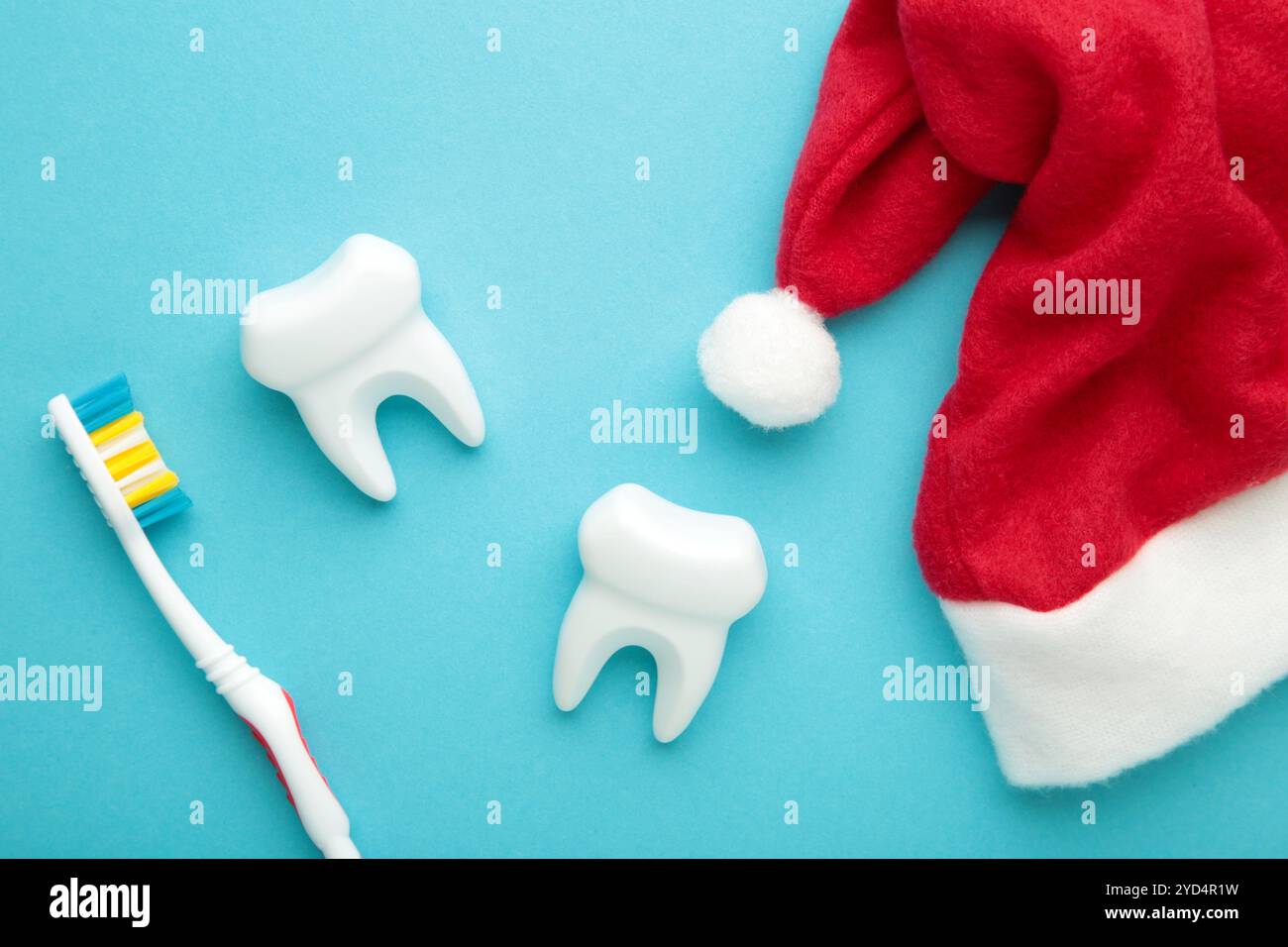 White teeth with santa hats on blue background. Dentist Merry Christmas ...