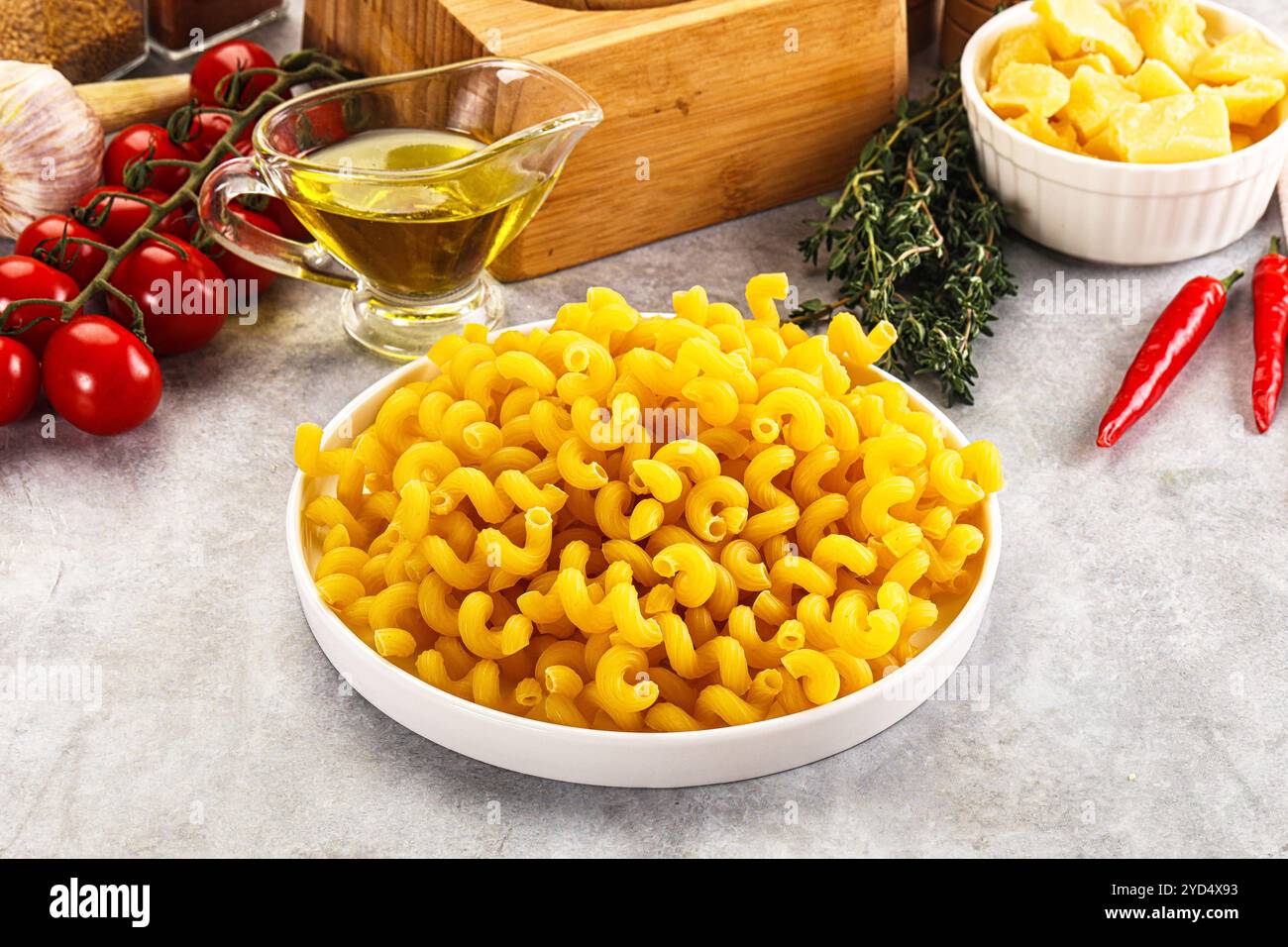 Italian cuisine - dry cellentani pasta for cooking Stock Photo - Alamy
