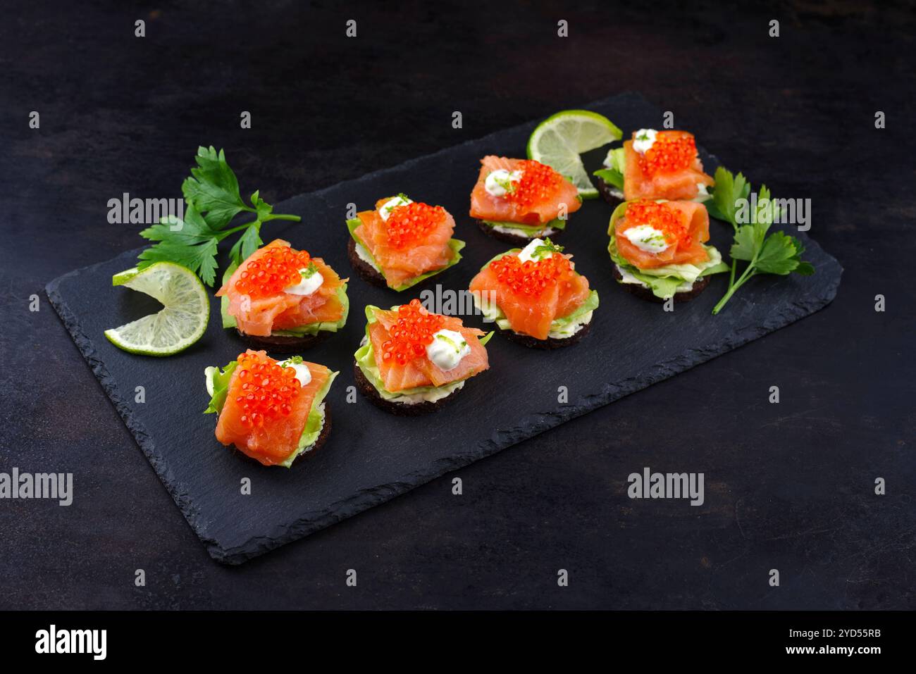 Traditional Pumpernickel Taler with smoked salmon and caviar served as ...