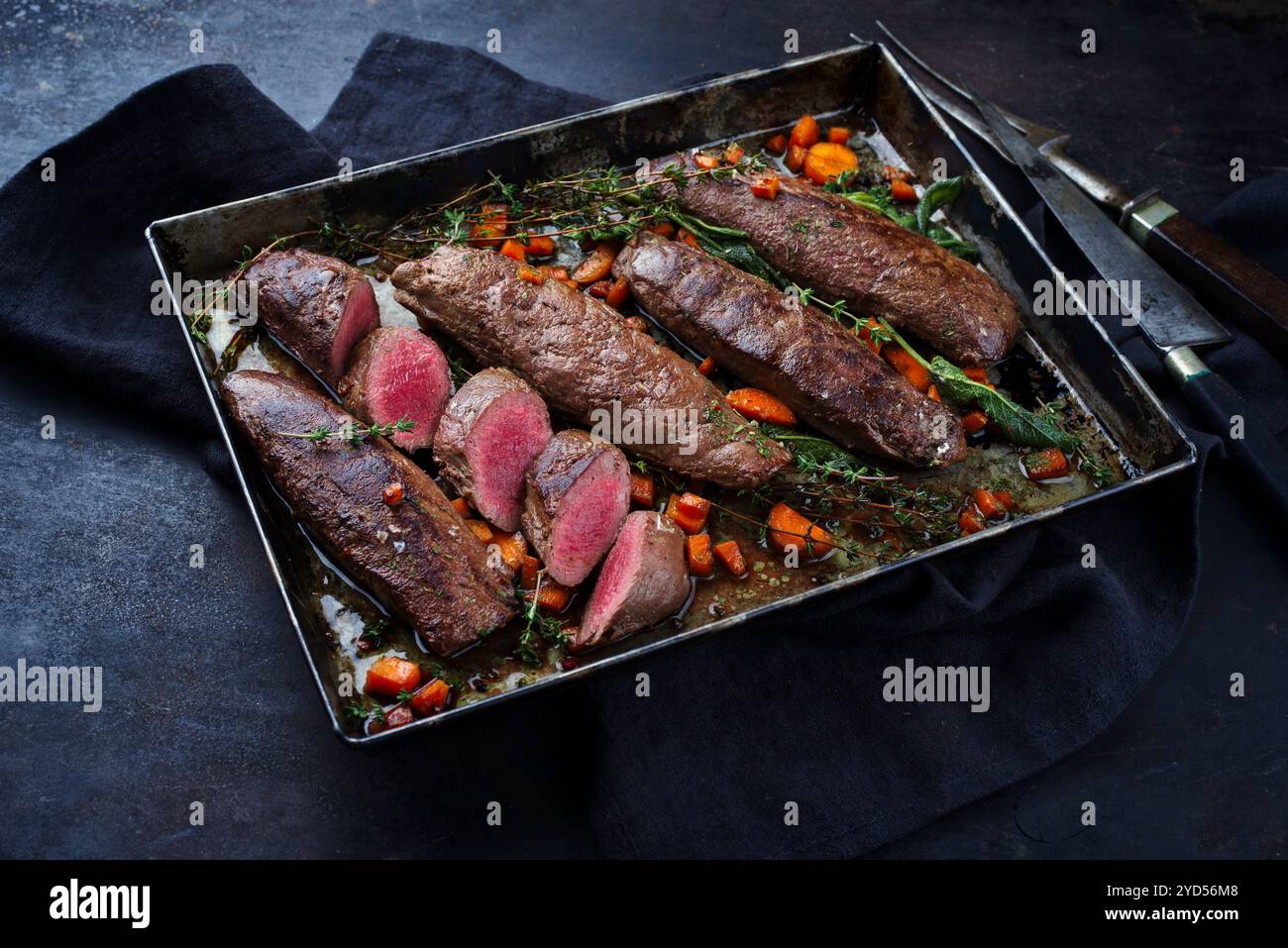 Traditional fried venison back filet with chard Stock Photo - Alamy