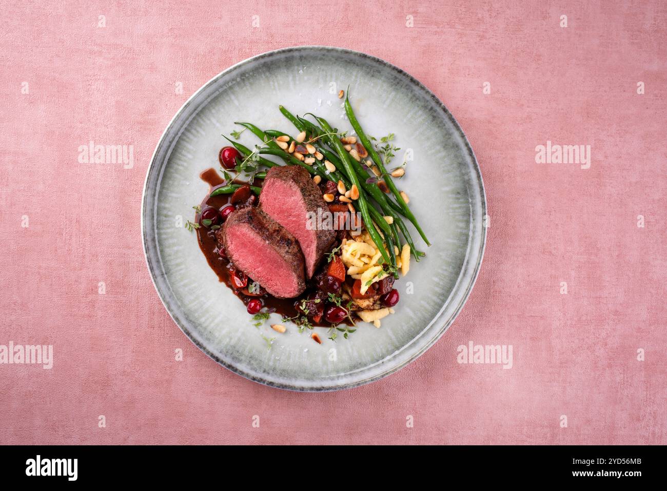 Traditionally roasted saddle of venison fillet with spaetzle Stock ...