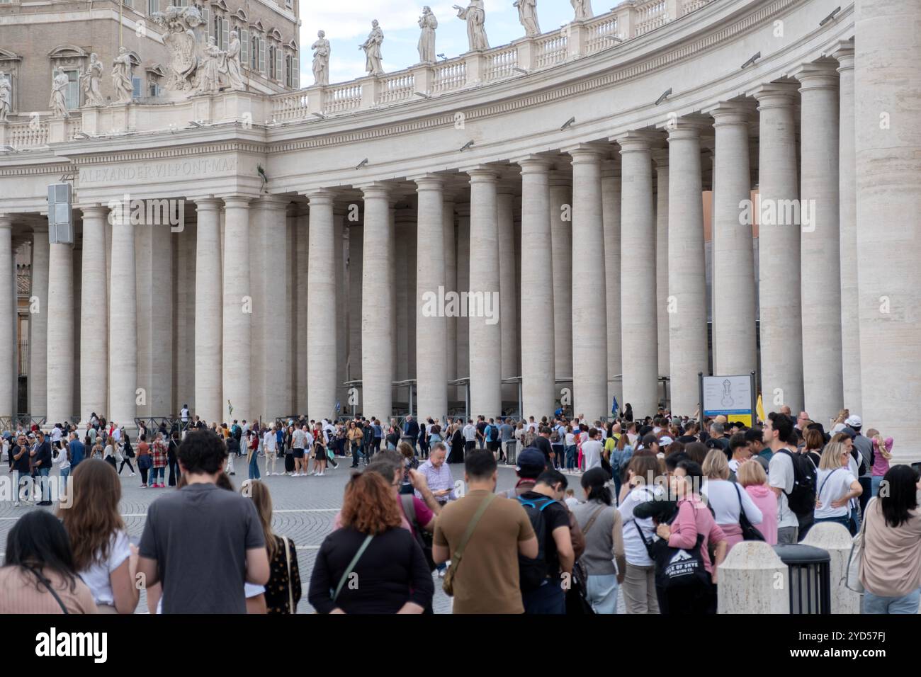 Queues of tourists waiting for entrance to the basilica, St. Peter's ...