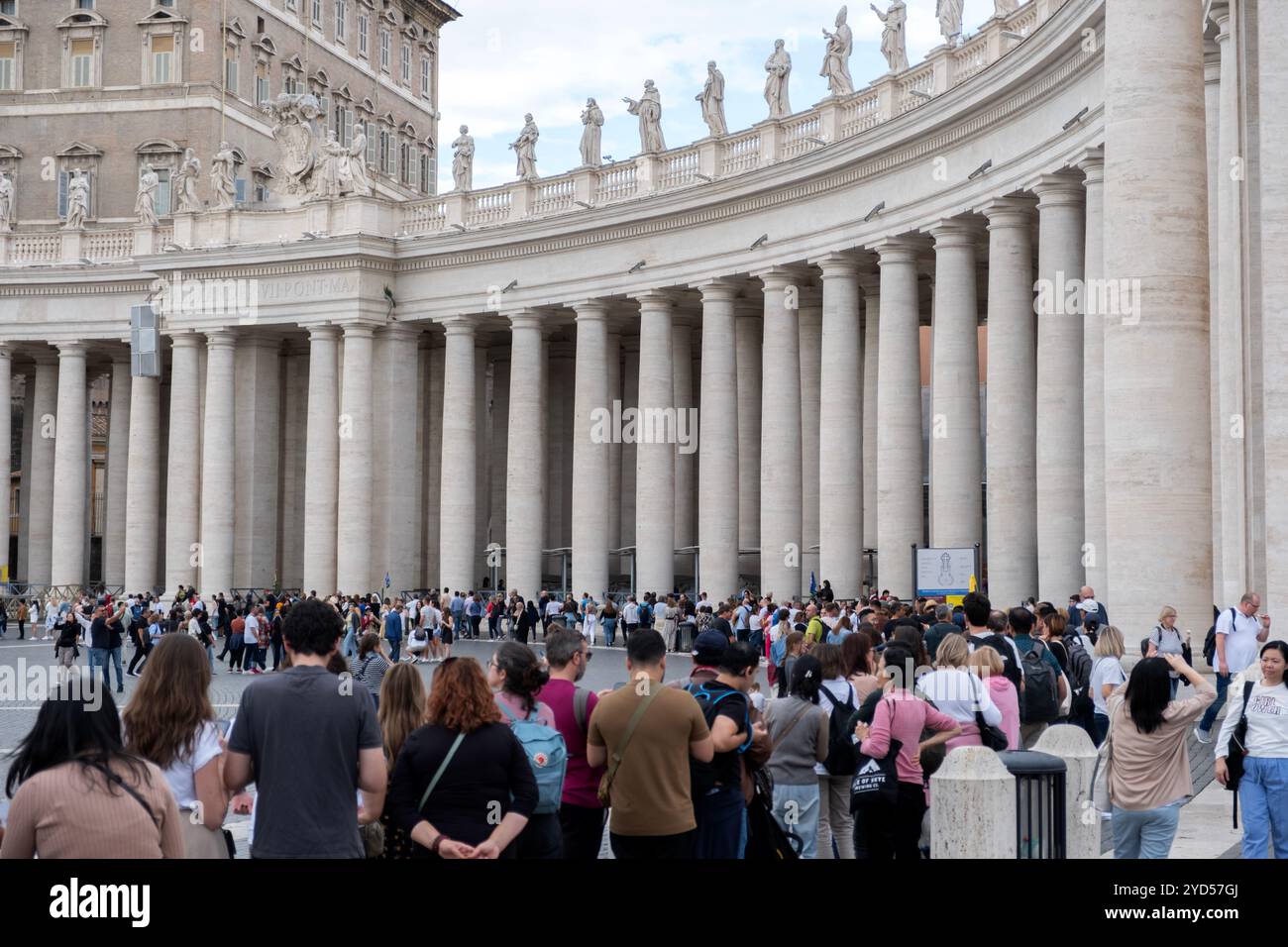 Queues of tourists waiting for entrance to the basilica, St. Peter's ...