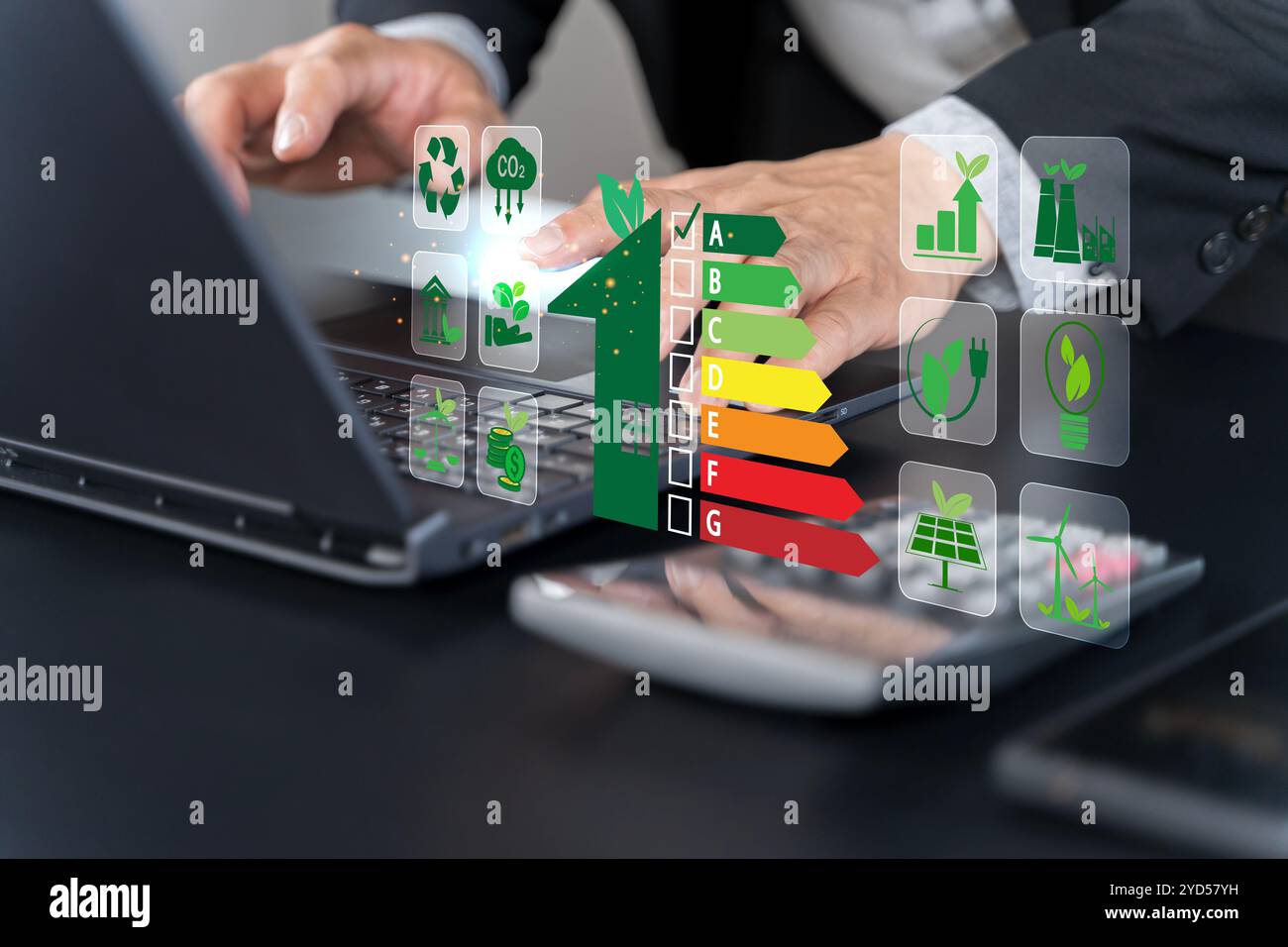 Energy efficiency concept. Businessman using laptop with energy ...