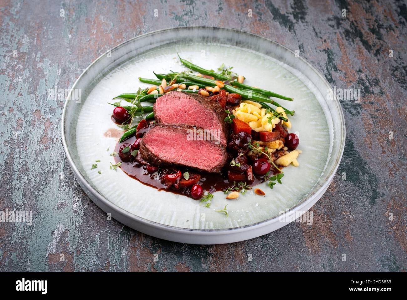 Traditionally roasted saddle of venison fillet with spaetzle Stock ...