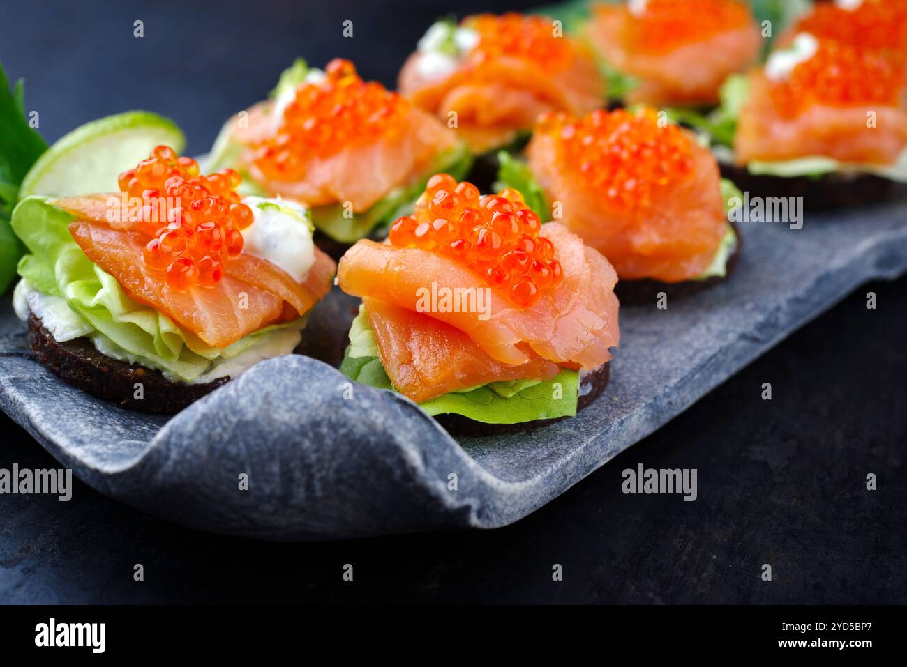 Traditional Pumpernickel Taler with smoked salmon and caviar served as ...