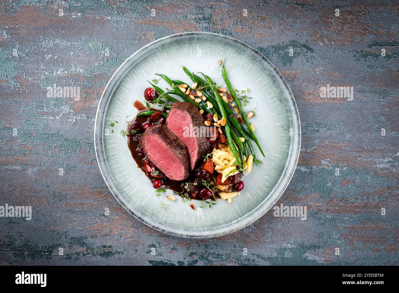 Traditionally roasted saddle of venison fillet with spaetzle Stock ...