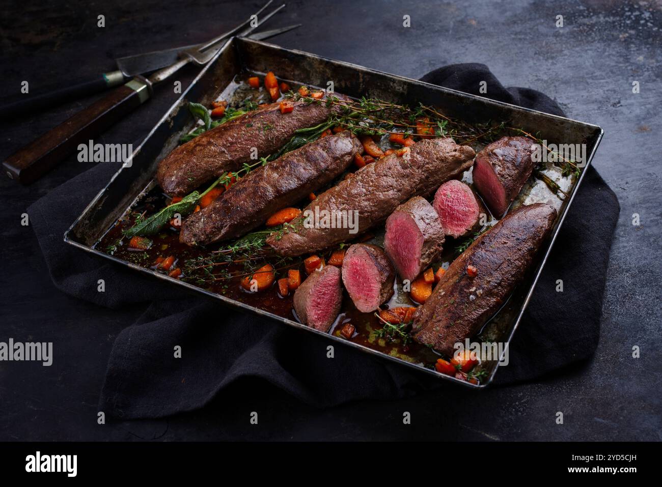 Traditional fried venison back filet with chard Stock Photo - Alamy