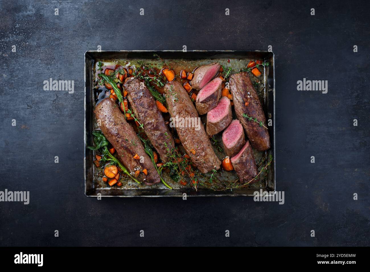 Traditional fried venison back filet with chard Stock Photo - Alamy