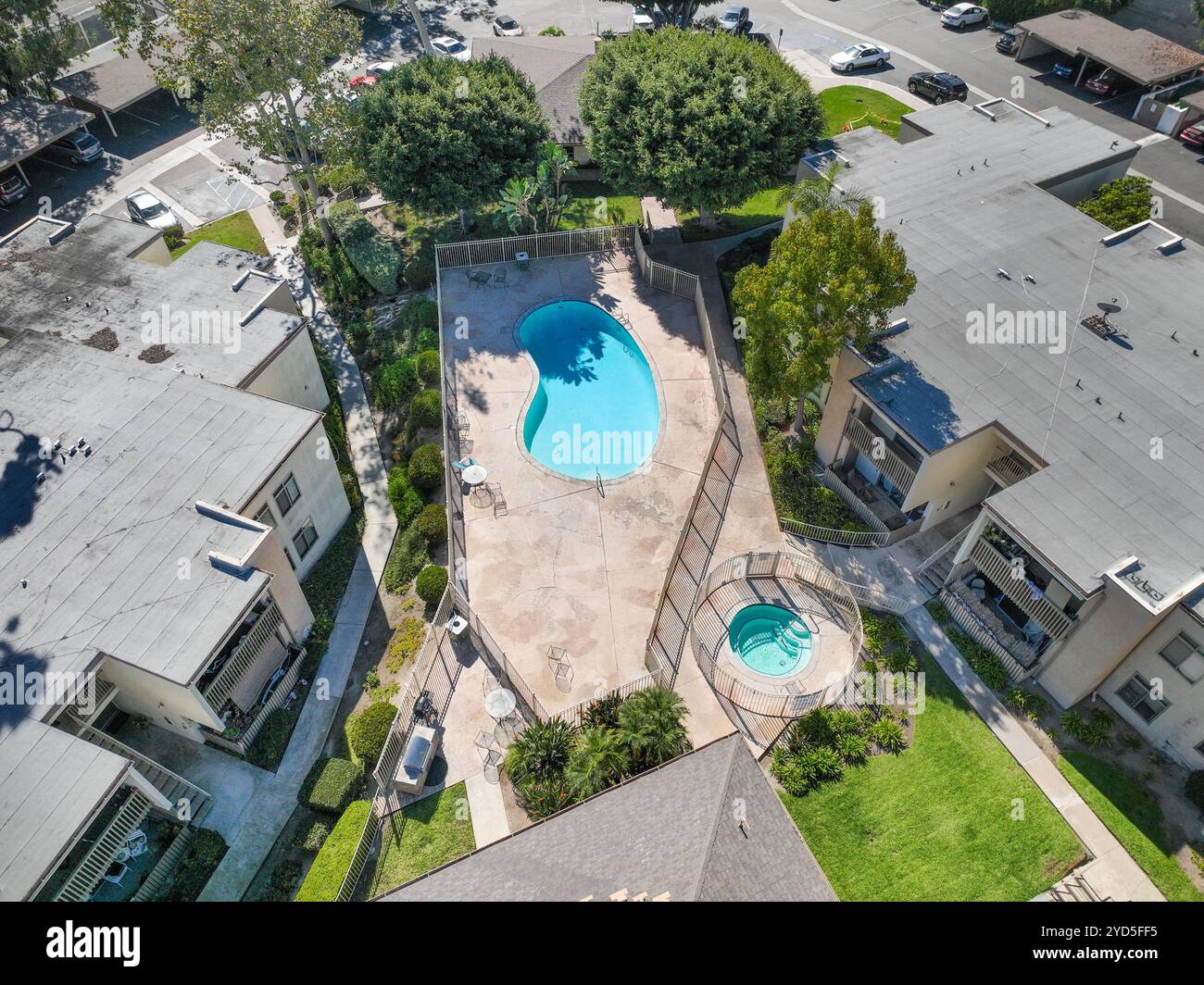 Gardens with pool and Jacuzzi in a the typical apartment complex ...