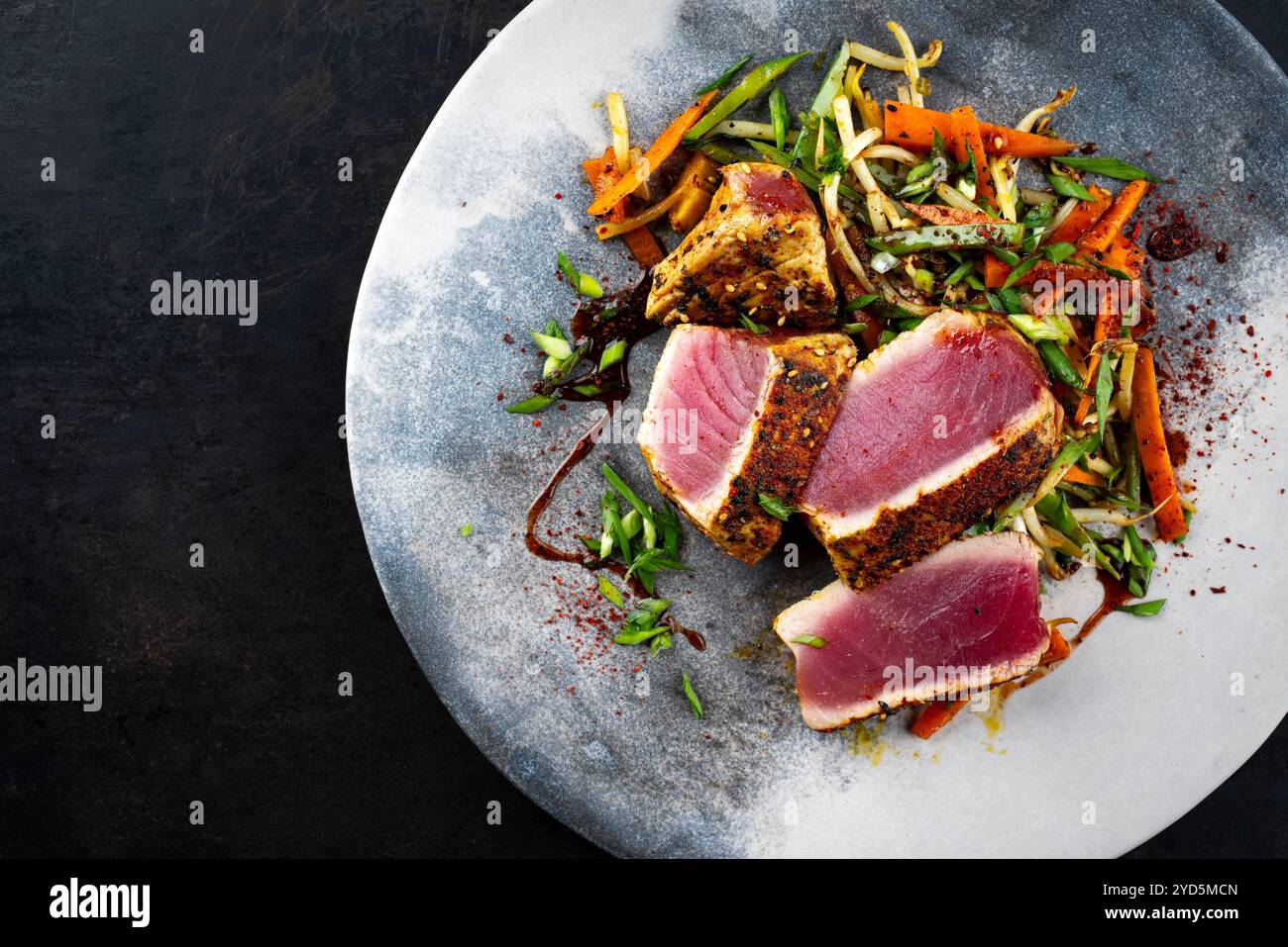 Traditional Japanese gourmet tuna fish steak tataki with vegetable ...