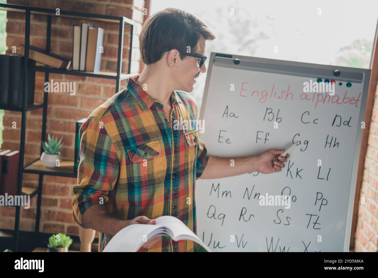 Photo of handsome young man teacher wear checkered shirt remote lesson ...