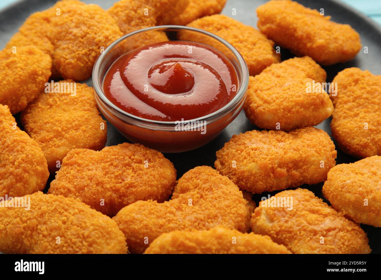 Chicken nuggets with ketchup on dark background. Top view Stock Photo ...