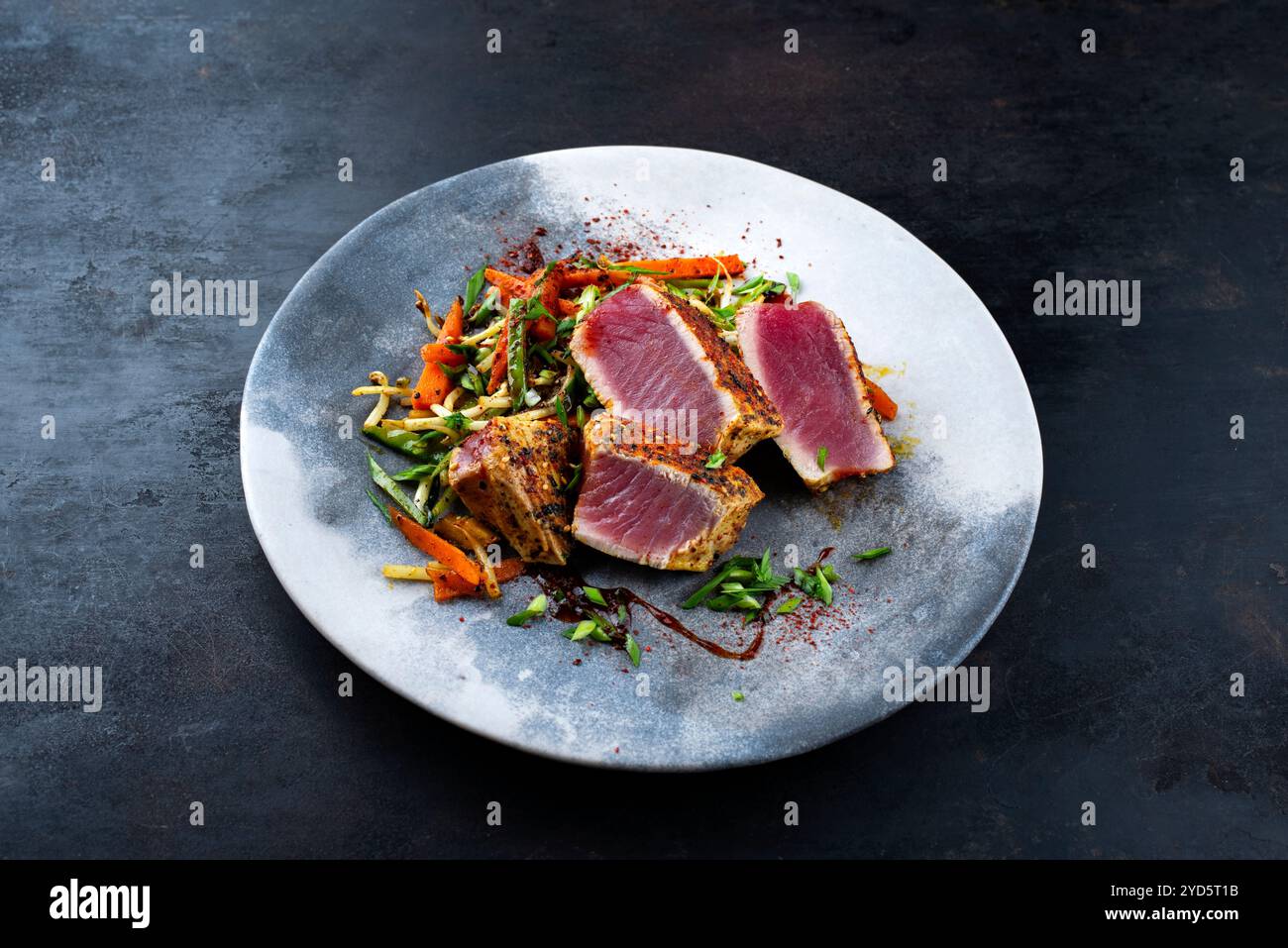 Traditional Japanese gourmet tuna fish steak tataki with vegetable ...