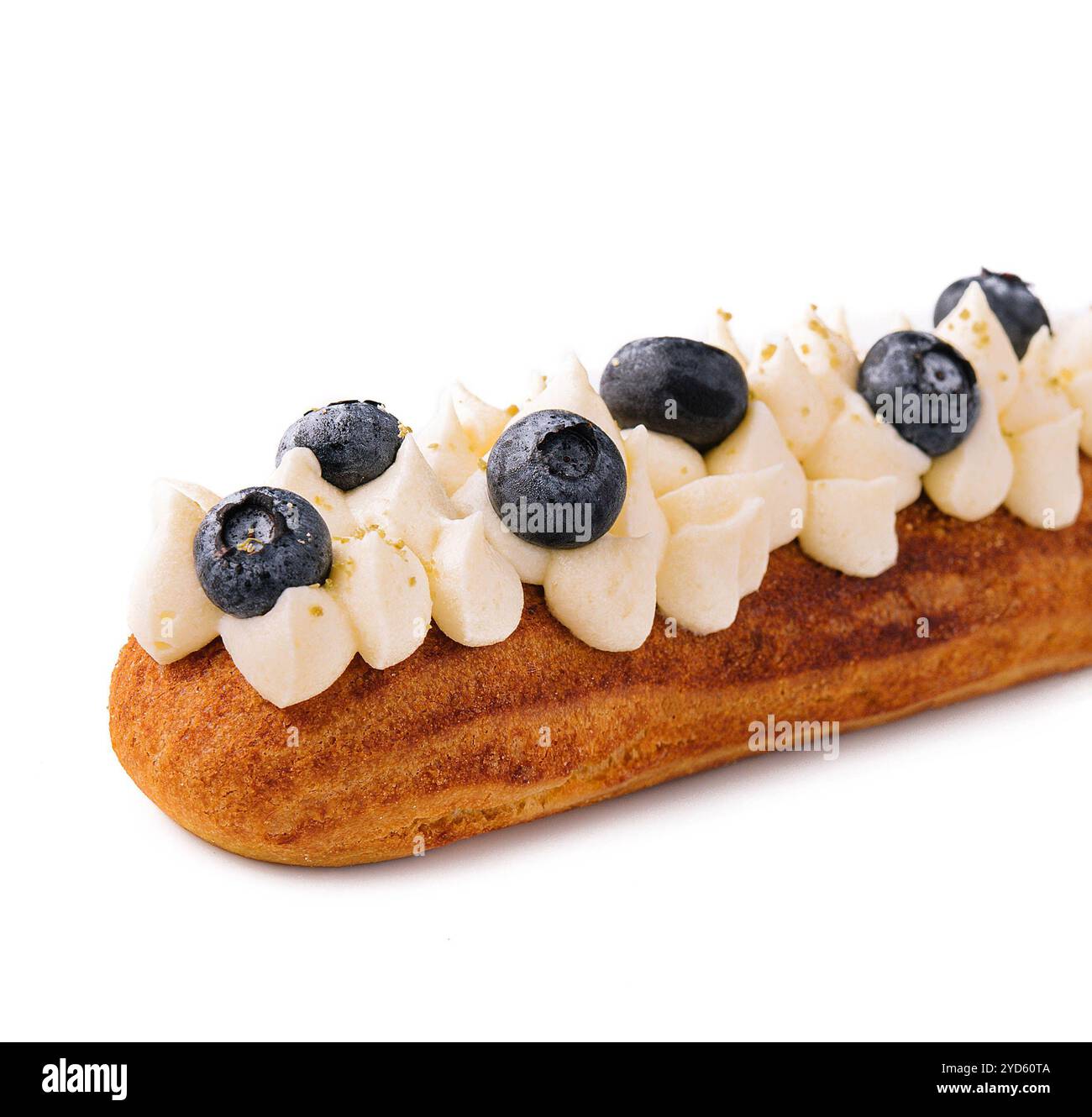 Eclair with buttercream and blueberries Stock Photo - Alamy