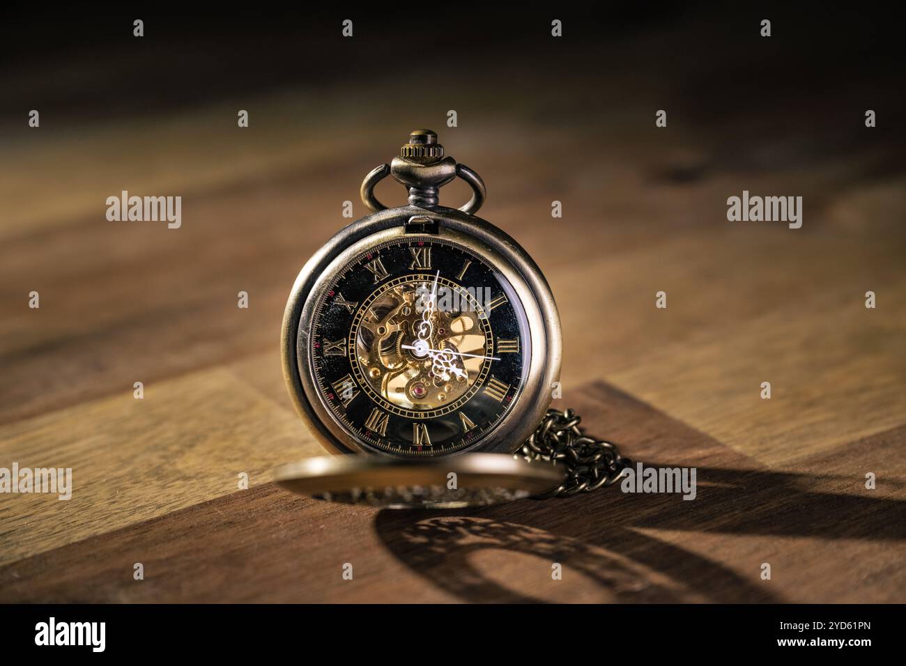Five minutes to midnight on an old fashioned golden pocket watch, macro ...