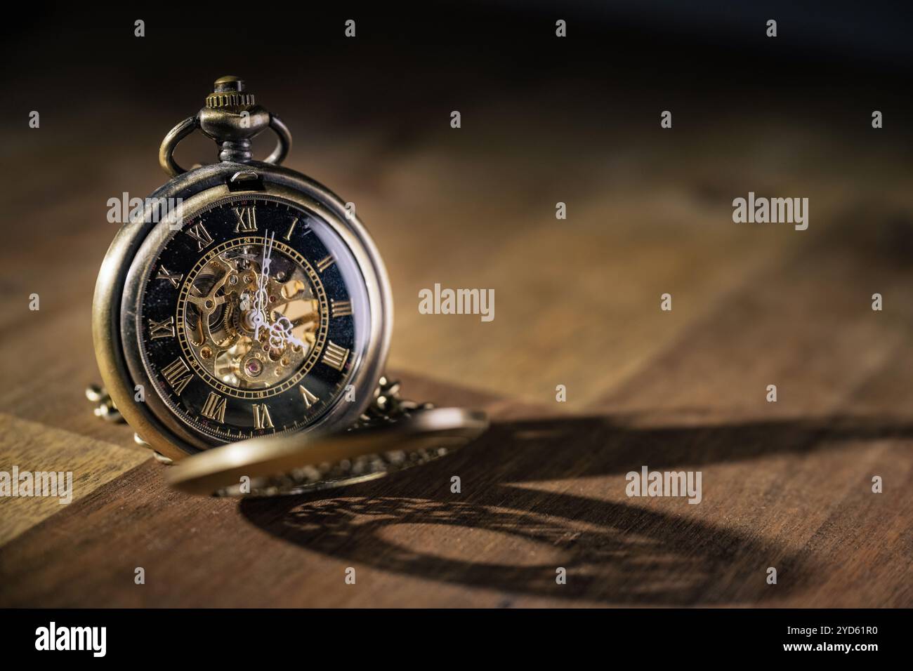 Beautiful open antique gold pocket watch ticking, on the golden ...