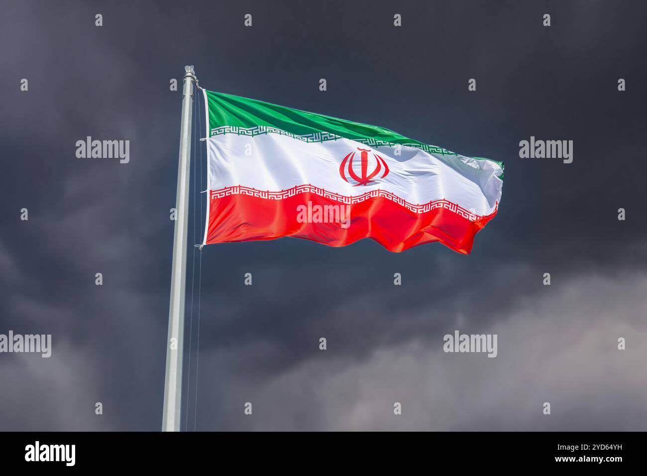 Flag of Iran waving in the wind against the dark sky Stock Photo - Alamy