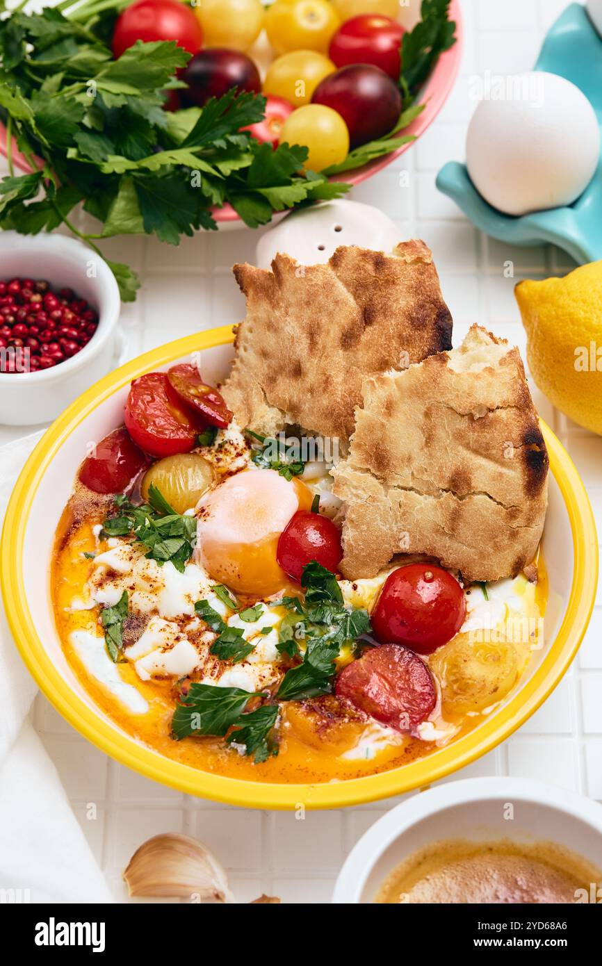 Cilbir or Turkish Eggs in white bowl. Turkish cuisine concept Stock ...