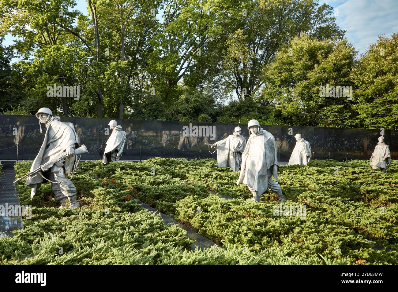 Statues of soldiers at the Korean War Veterans Memorial. The scene ...