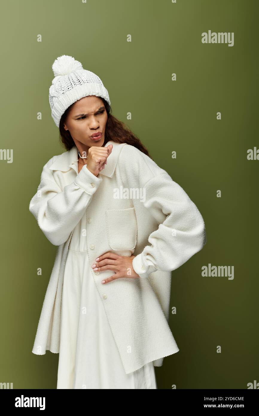 A confident woman playfully gestures with a charming expression while ...