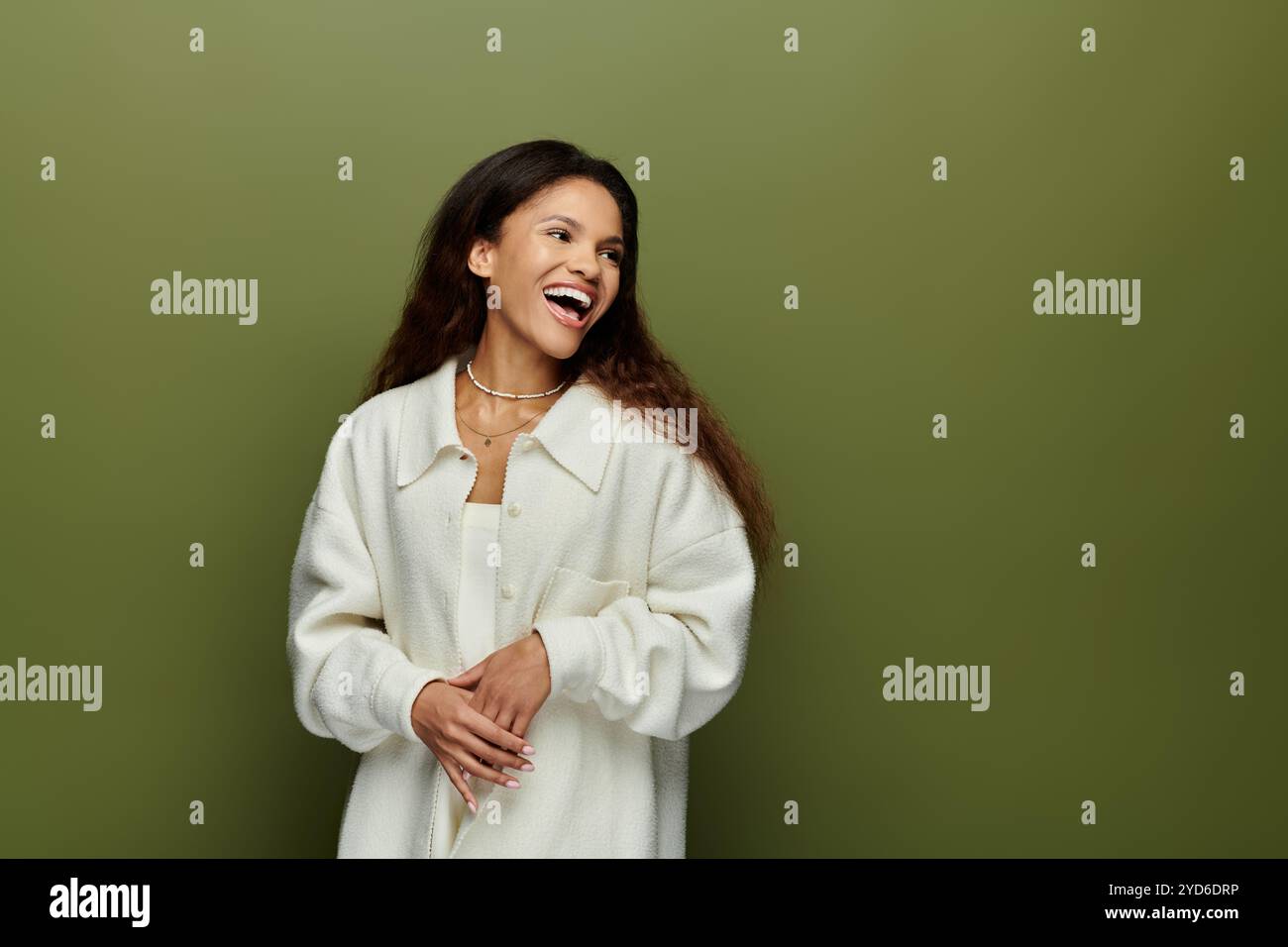 A woman exudes happiness as she smiles brightly, creating a delightful ...