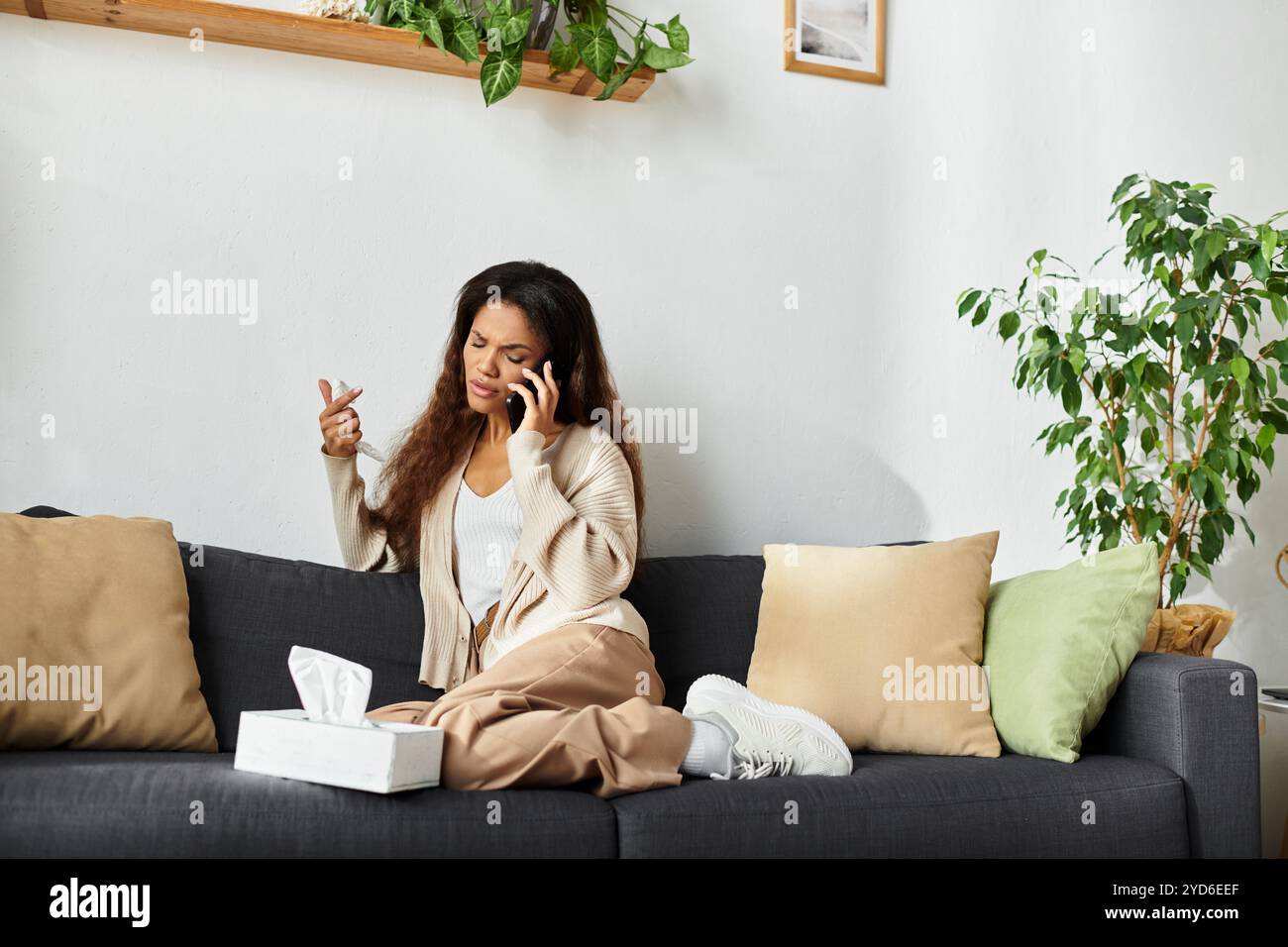 A woman sits on a cozy couch, deep in conversation, expressing her ...