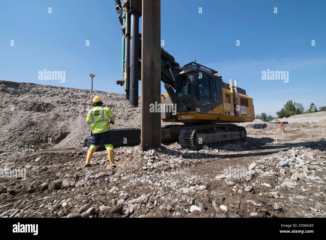 Excavator and digging in hydraulic engineering Stock Photo - Alamy
