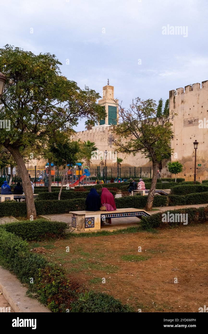 Mother and child playing in the square of Place Lalla Aouda in the city ...