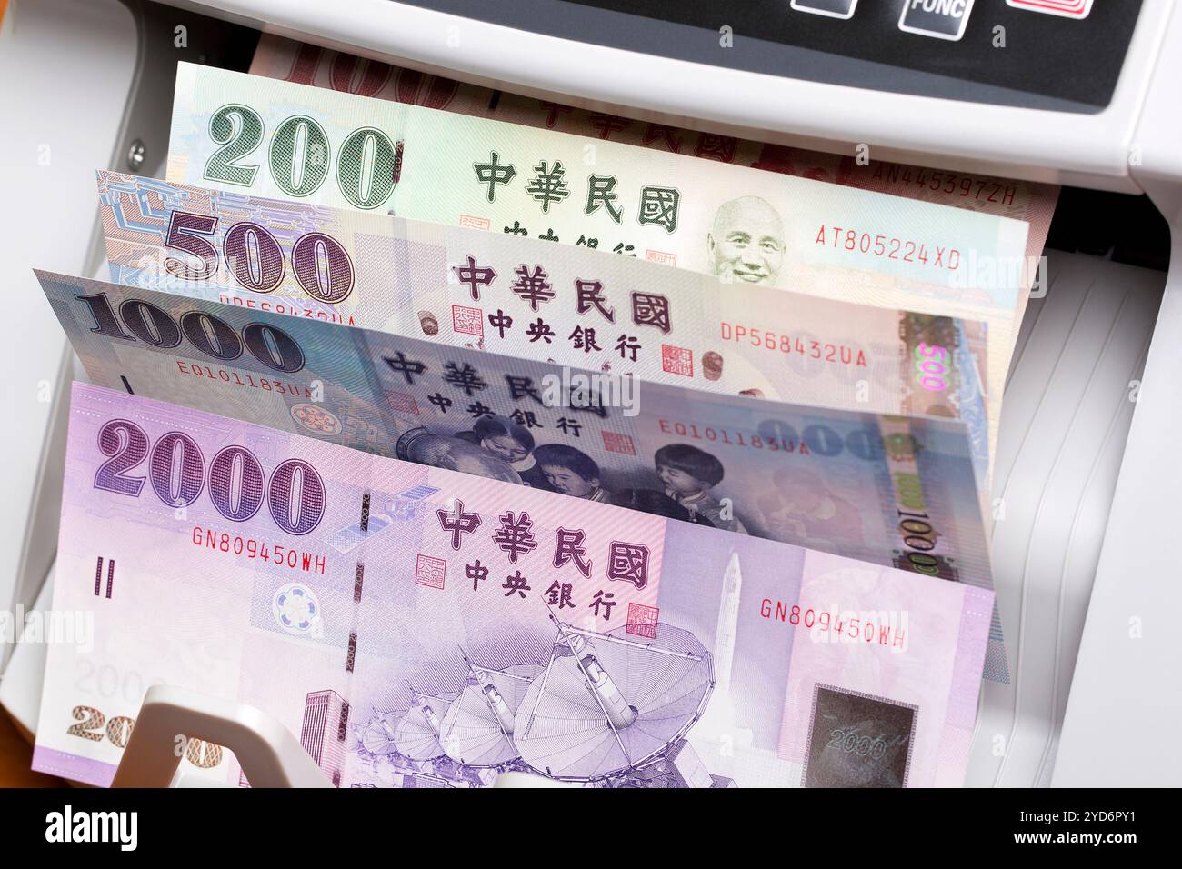 Taiwan dollar in a counting machine Stock Photo - Alamy