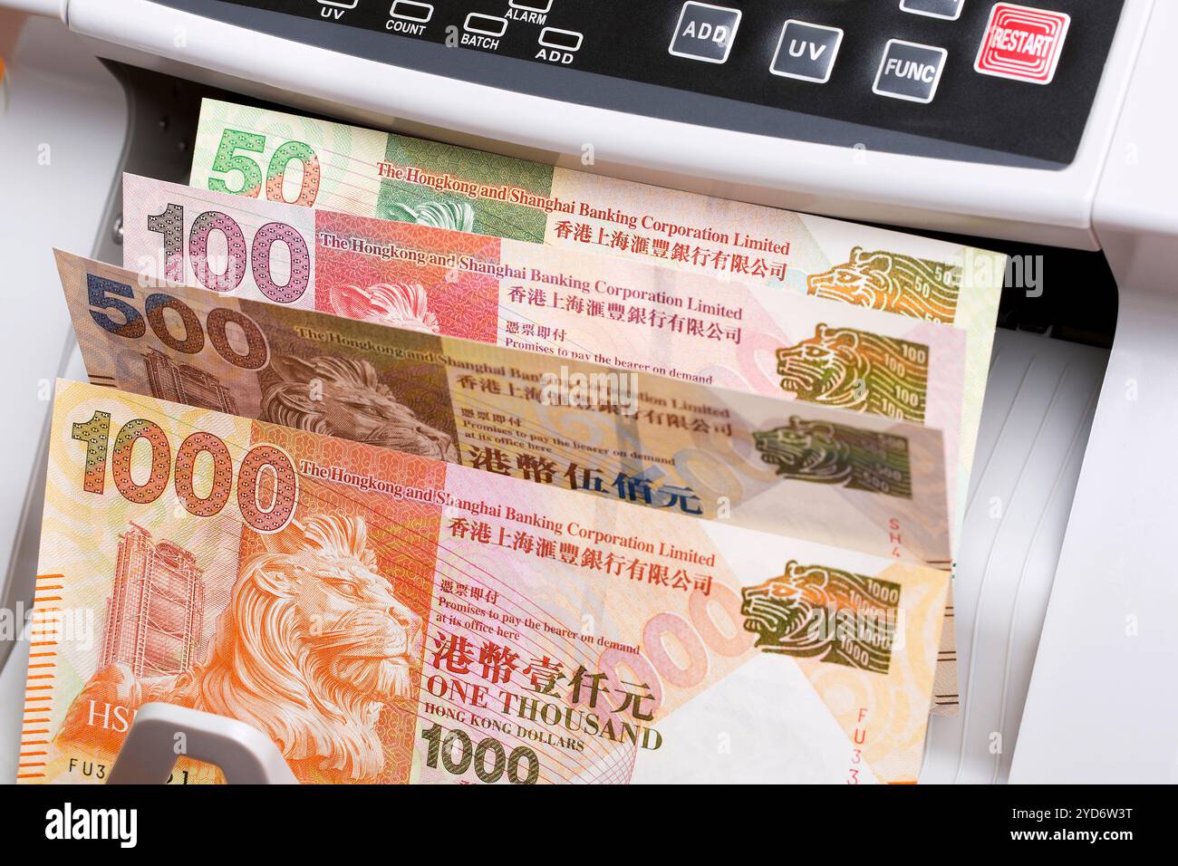 Hong Kong dollar in a counting machine Stock Photo - Alamy