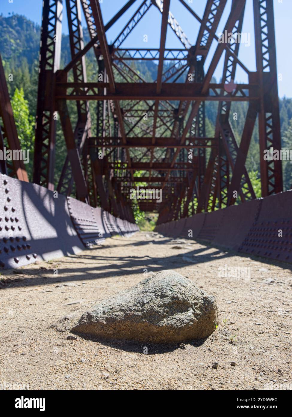 Large rock on pedestrian bridge Stock Photo - Alamy