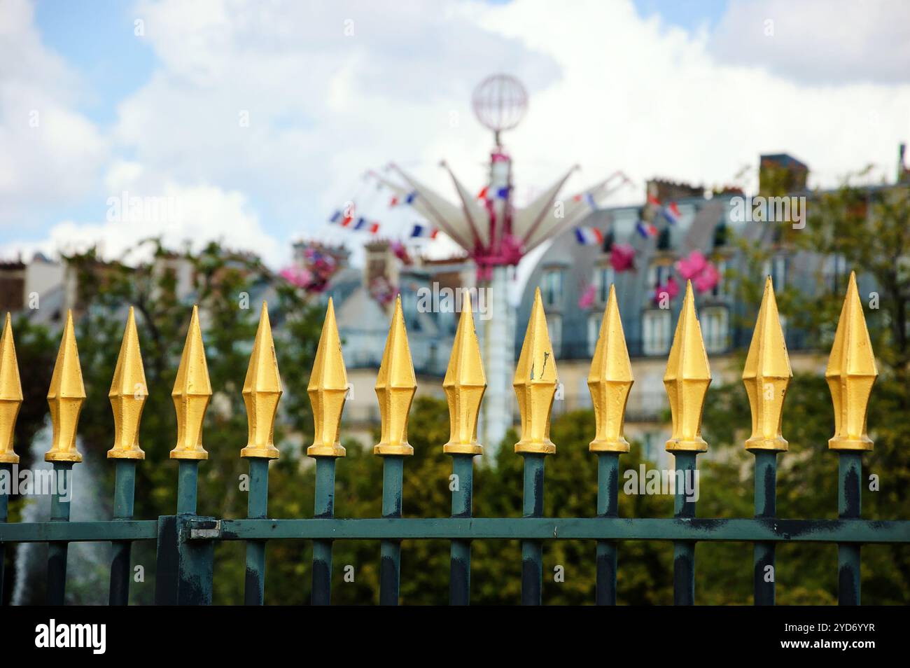 Tuileries Garden. Forging fence and carousel in decorated with French ...