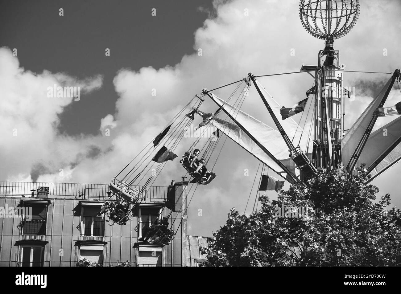 Paris, France. People have fun at the fair in Tuileries Garden riding a ...