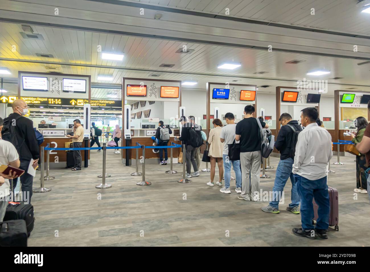 Tourists at Immigration stands, Visa on arrival voa at Arrivals ...