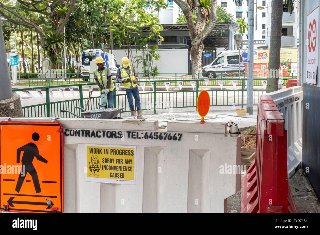 Road works, workers, in Marine Parade, Singapore, "Work in progress ...