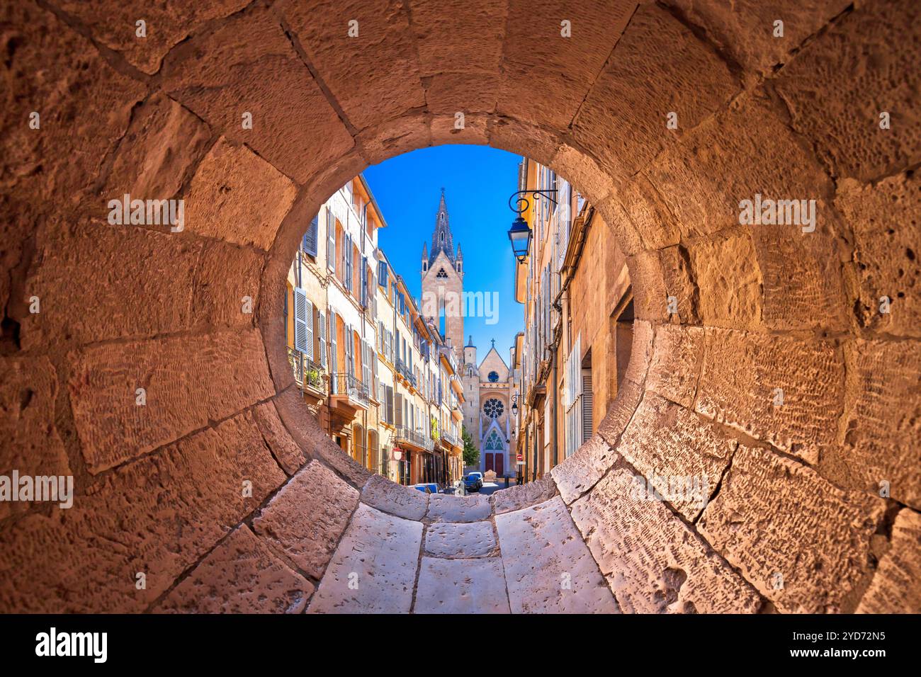Aix En Provence scenic alley and church view through stone window Stock ...
