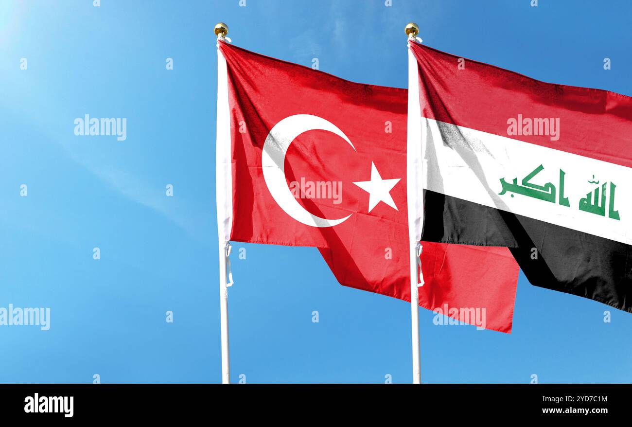 Iraqi and Turkish flags flutter under cloudy sky. fly in the sky Stock ...