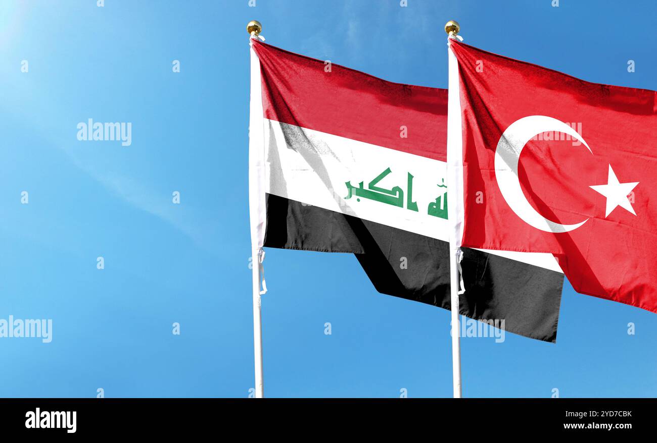 Iraqi and Turkish flags flutter under cloudy sky. fly in the sky Stock ...