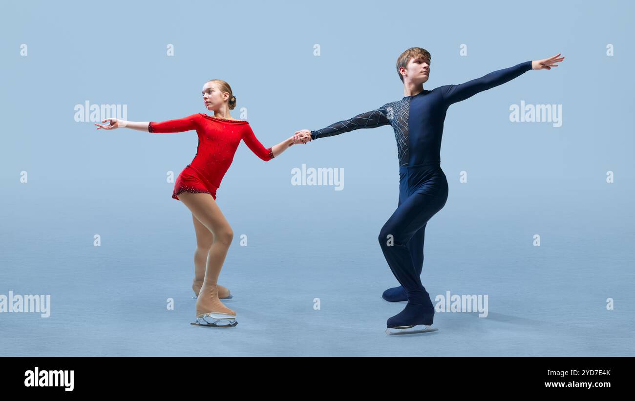 Dynamic photo of figure skating duo in synchronized pose, highlighting ...