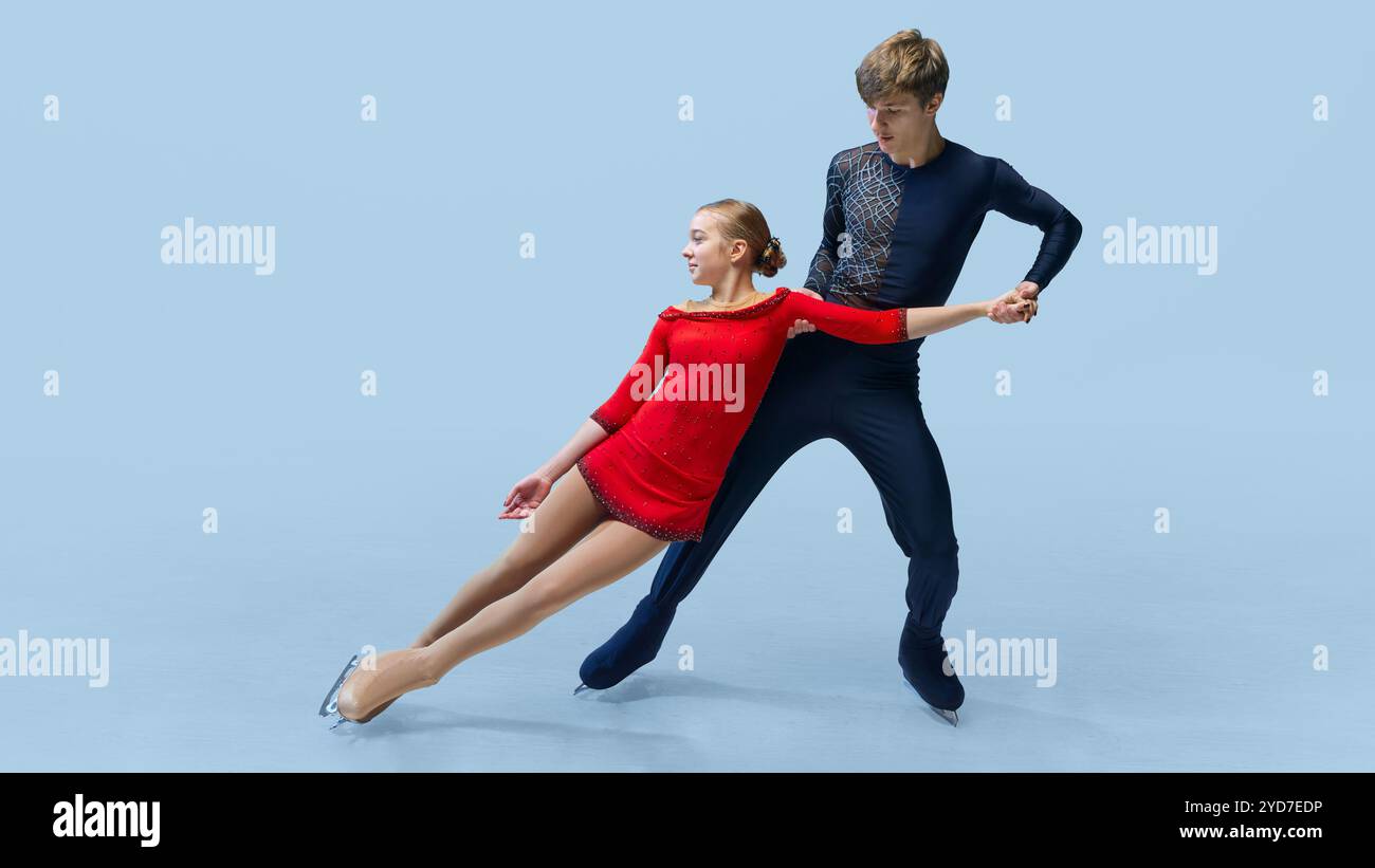Ice dance. Perfect form. Male skater supports his partner as she bends ...