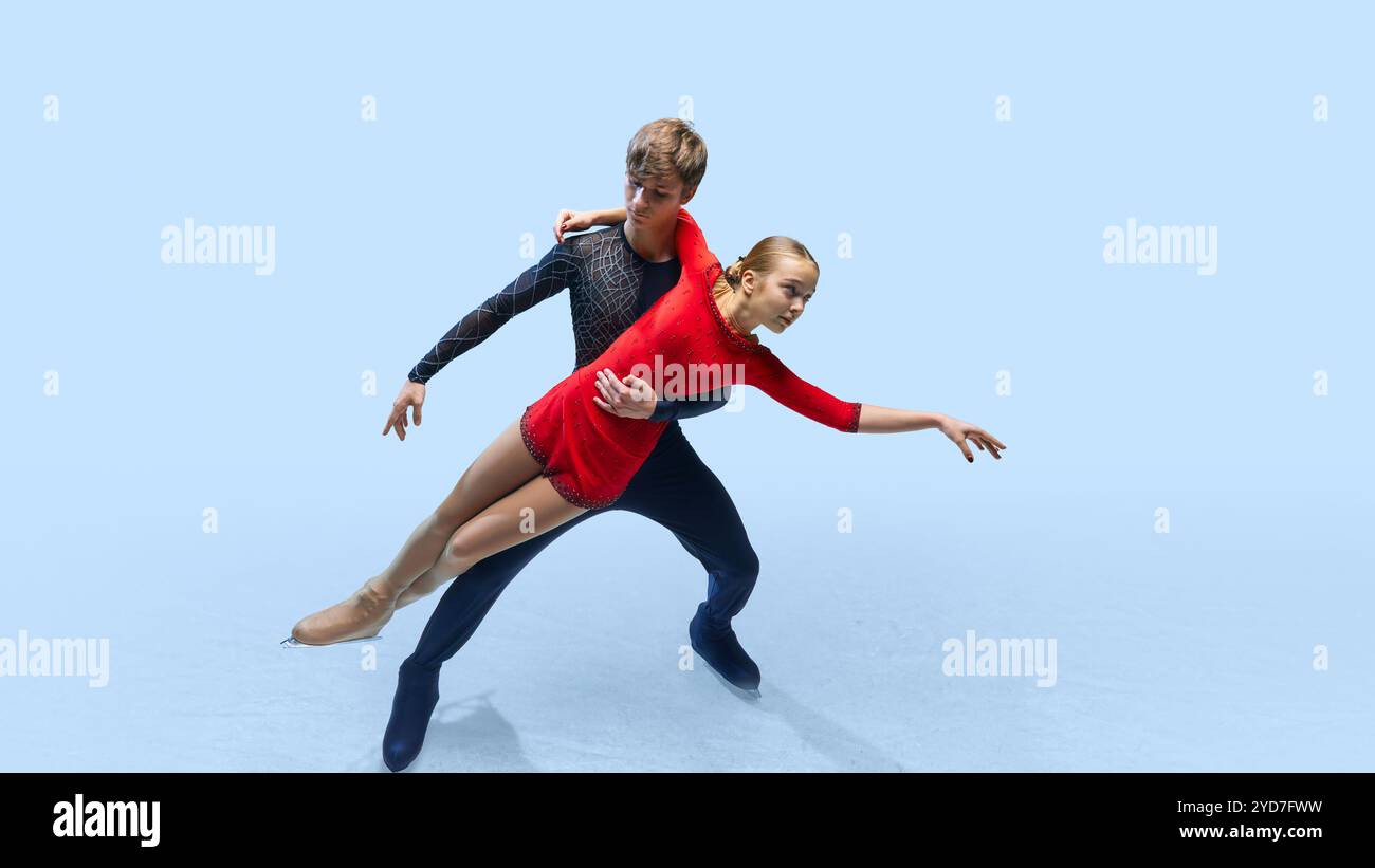 Pair of ice skaters in middle of their performance, emphasizing ...
