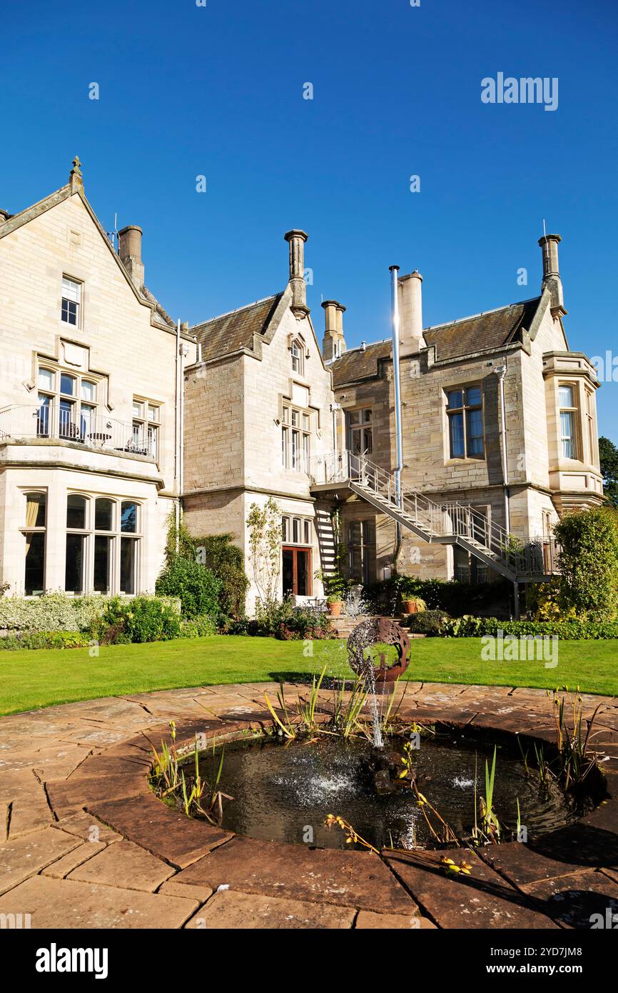 The historic mansion house and garden pond at SCHLOSS Roxburghe near ...
