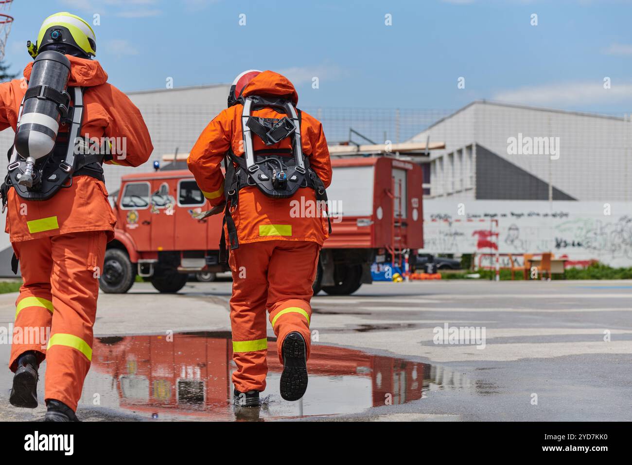 Firefighter Team Training with Various Tools in Professional Gear Stock ...